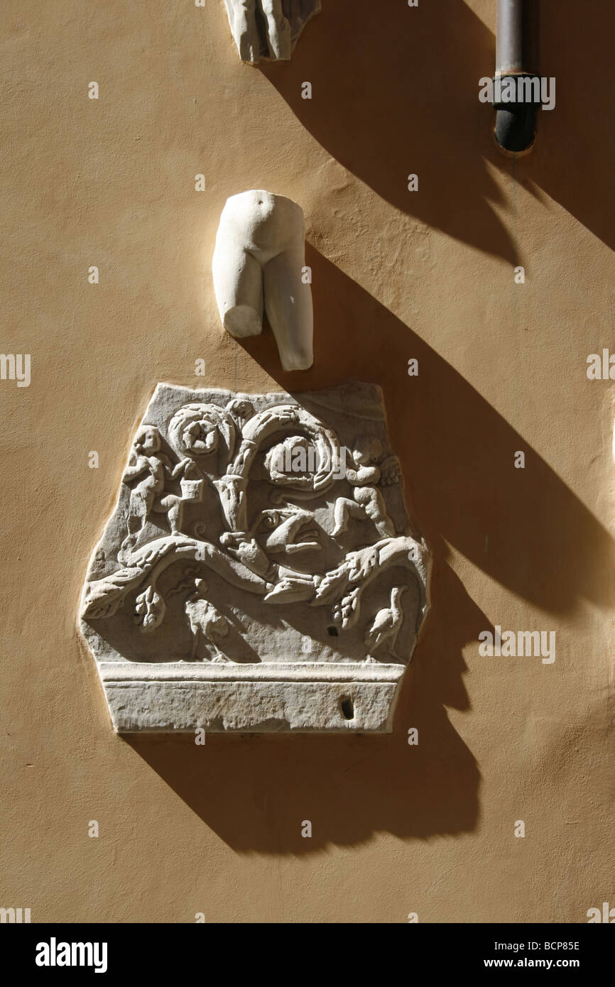 ancient roman relics on property wall near via del corso street in rome ...