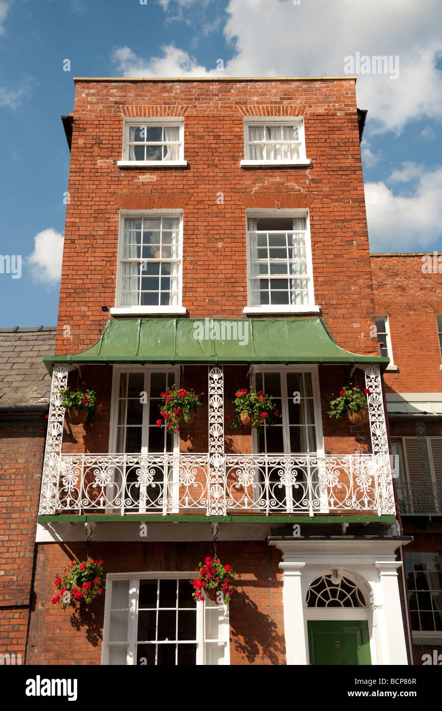 Wrought iron ornate balcony on regency era town house in Hereford city ...