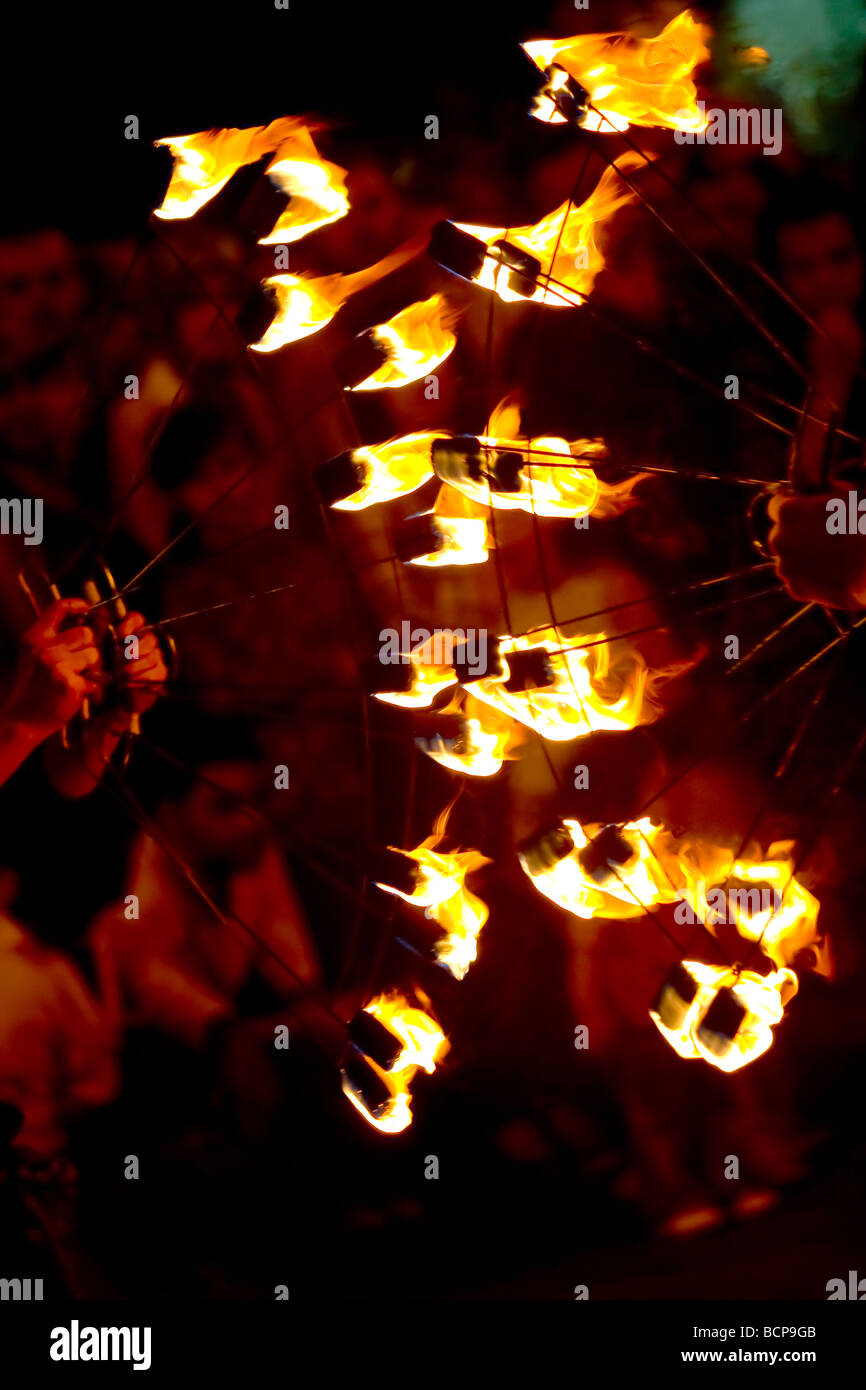 flames burning at street performance crowd in the background Stock ...
