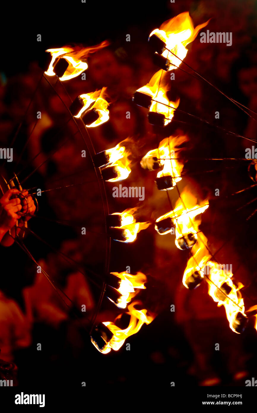flames burning at street performance crowd in the background Stock ...