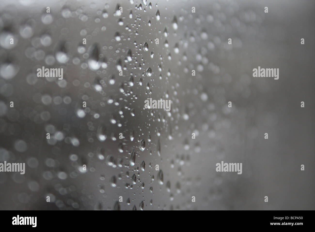 Rain on a window Stock Photo - Alamy