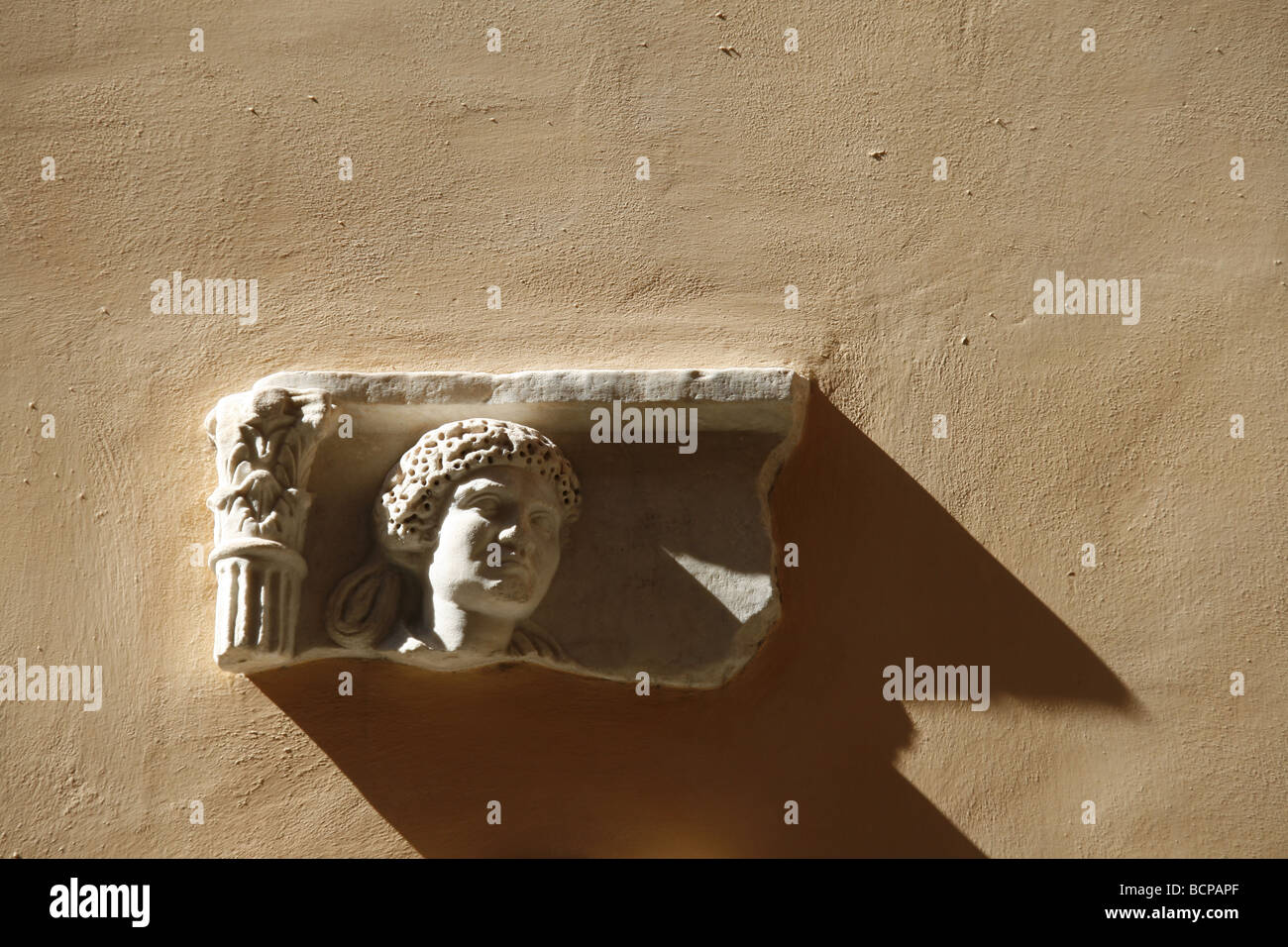 ancient roman relics on property wall near via del corso street in rome ...