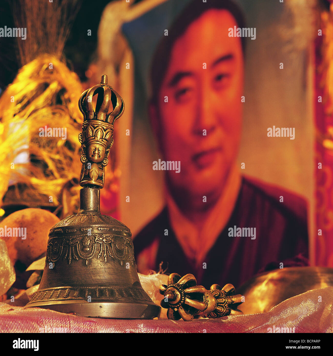 Shrine with ceremonial bell and the portrait of 10th Panchen Lama of ...