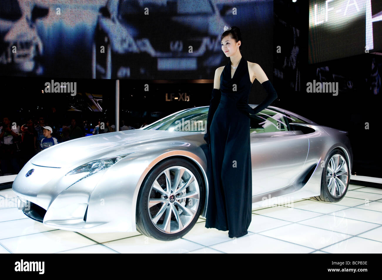 Beautiful Asian car model posing beside a Lexus concept car, 2008 ...