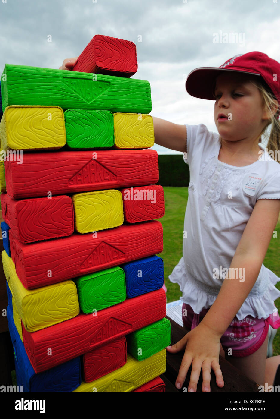 Playing a Game of Jenga in the Summer Holidays Stock Photo - Alamy