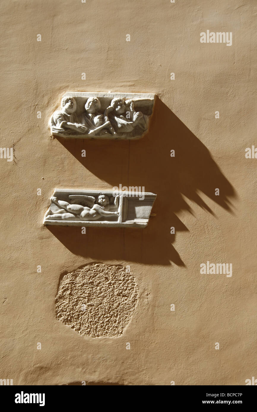 ancient roman relics on property wall near via del corso street in rome ...