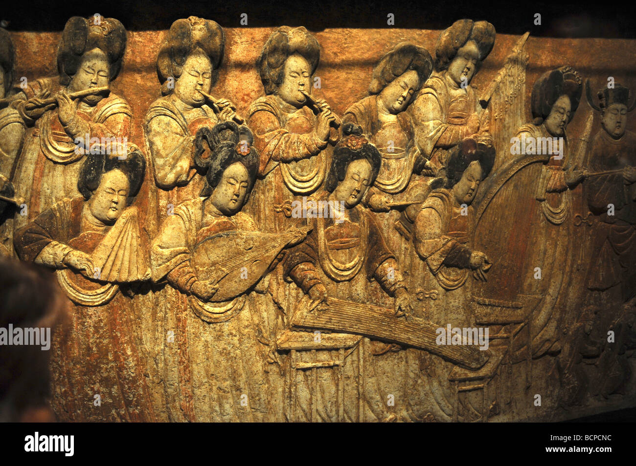 Stone carved relief depicting women musicians performing from Wudai ...