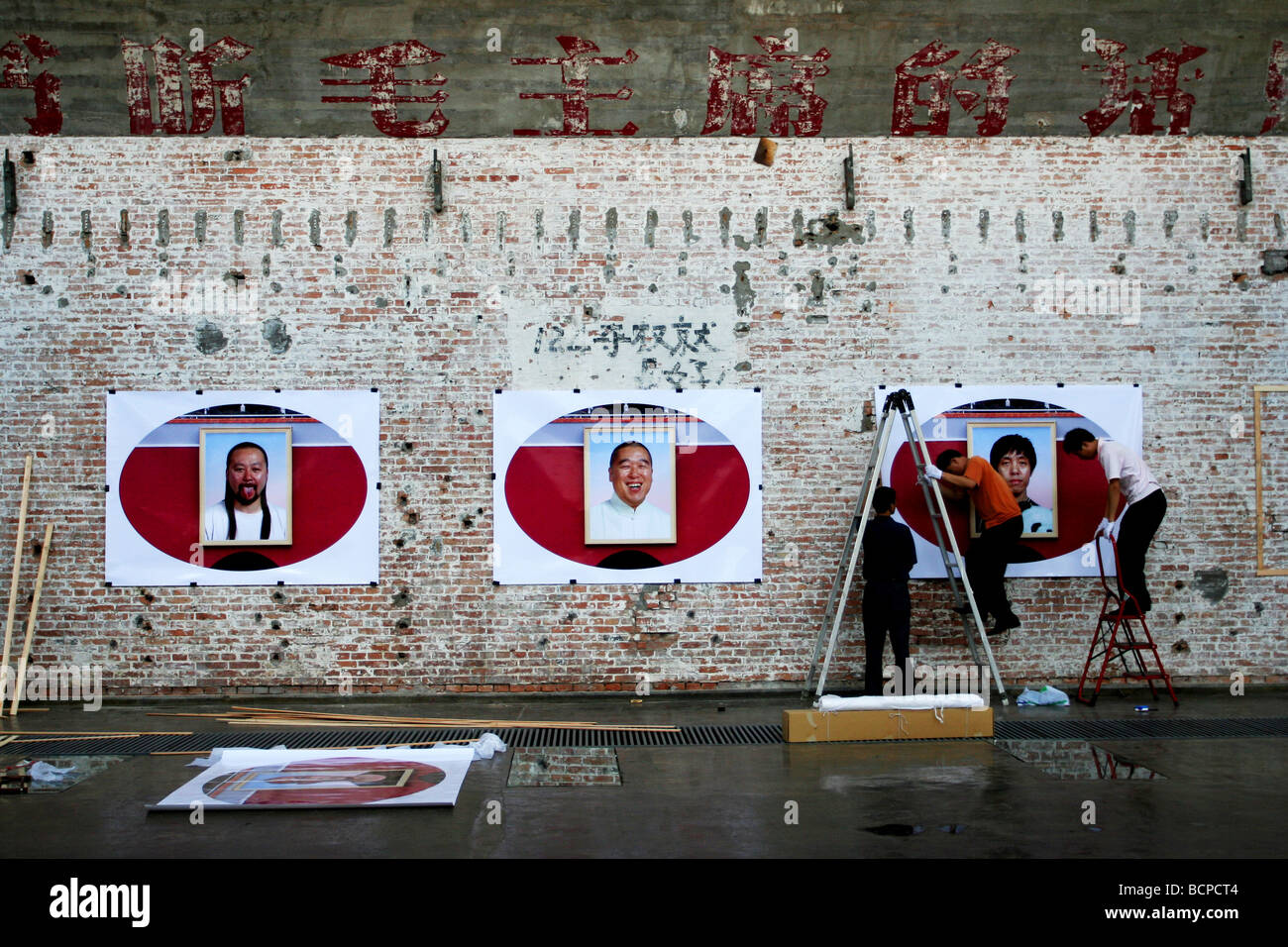 Gallery workers putting up a show, 798 Art District, Beijing, China ...
