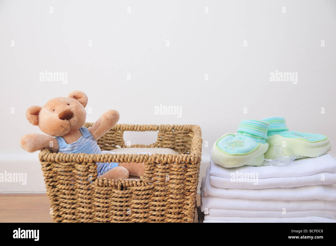 Baby still life with a traditional teddy bear, muslim squares and a ...