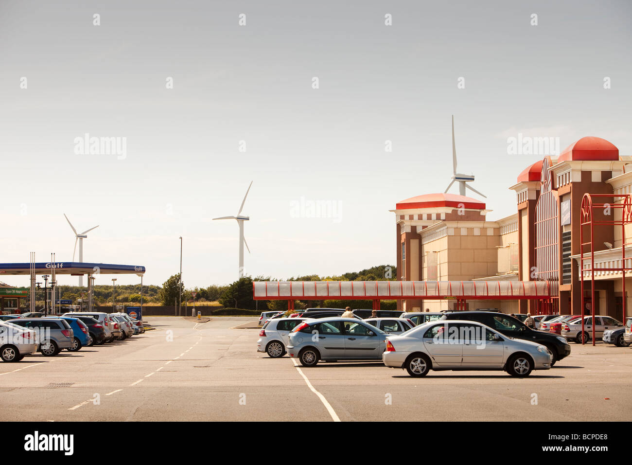 Wind turbines producing renewable electricity at a shopping centre on ...