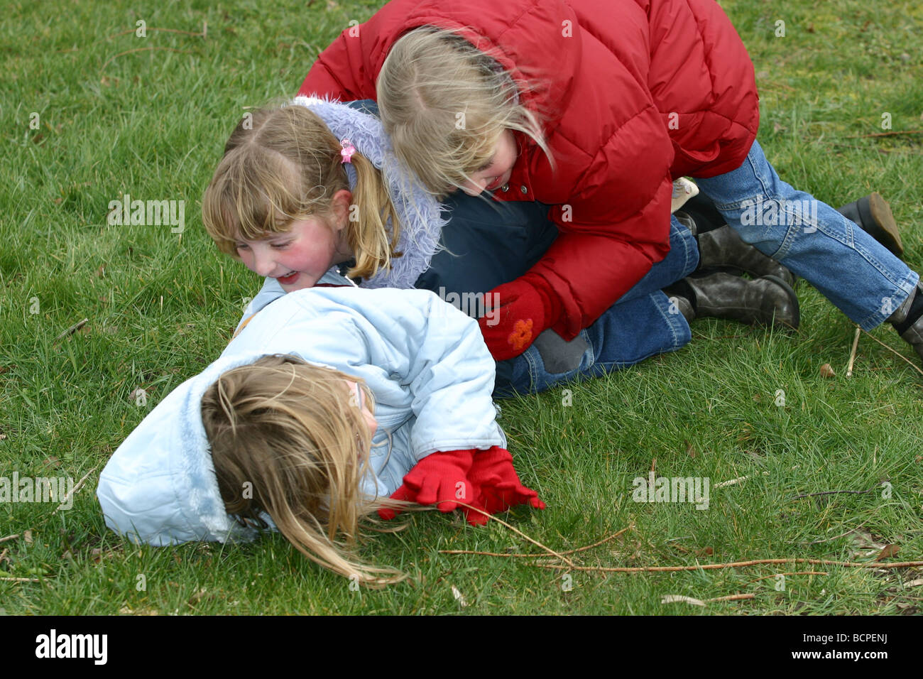 Children playing outdoors over active Stock Photo - Alamy
