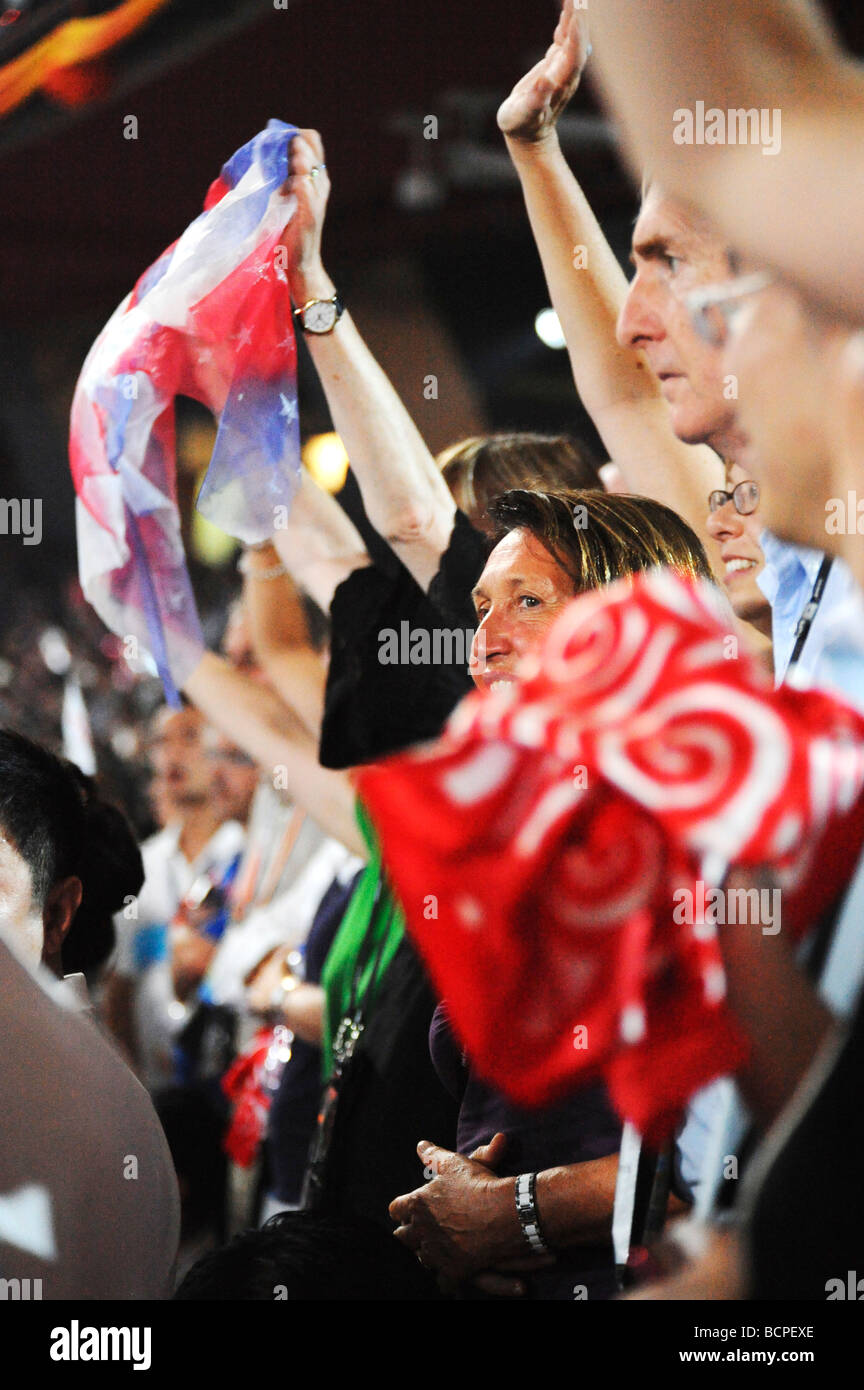 Foreigners cheering for atheletes from their country during 2008 ...