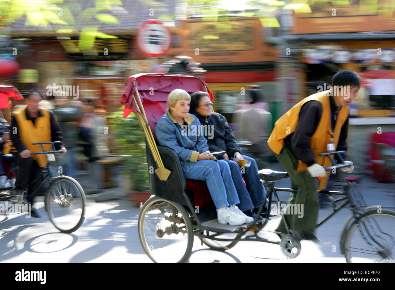 Rickshaw drivers taking tourists for a ride beside Bell Tower and Drum ...