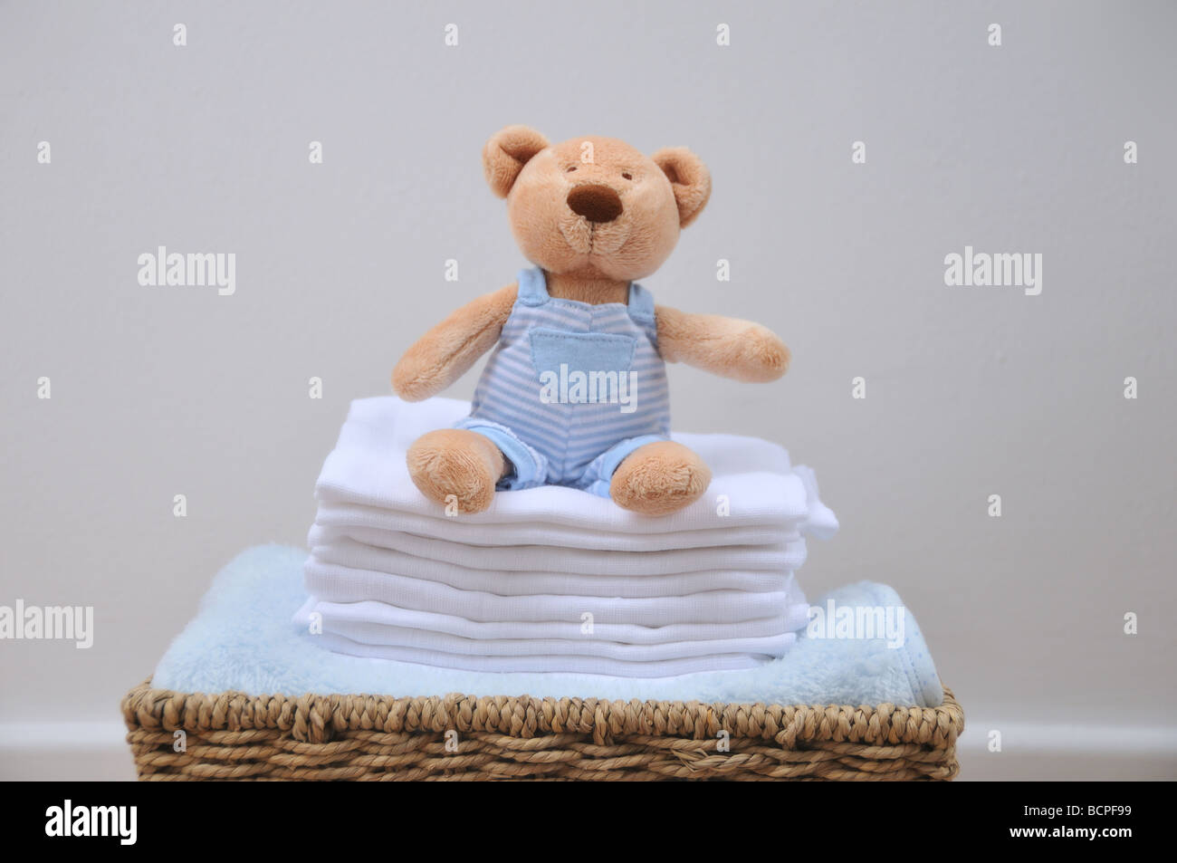 Baby still life with a traditional teddy bear, muslim squares and a ...