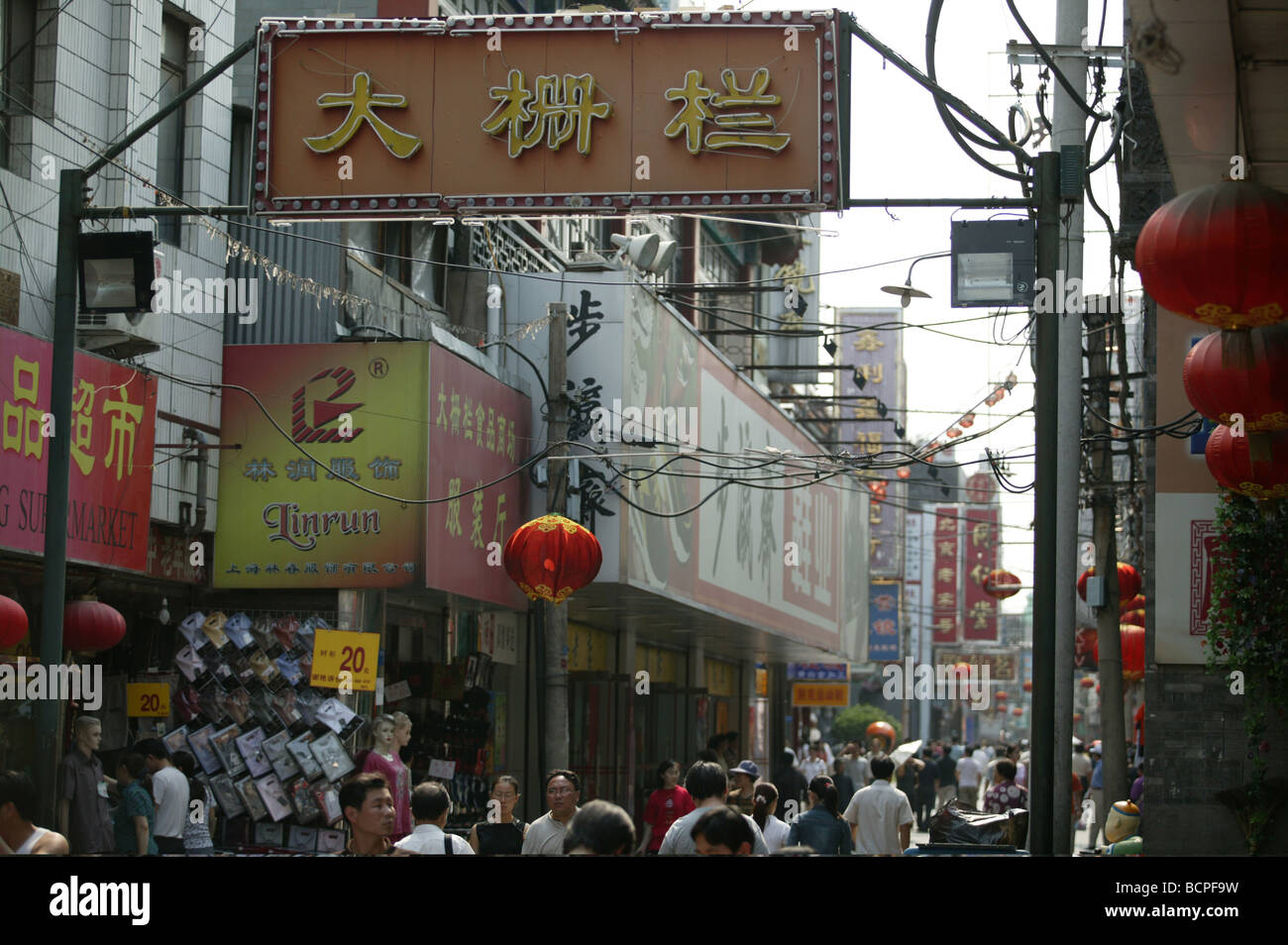 Crowded streets of Beijing's Dashila shopping area filled with old ...