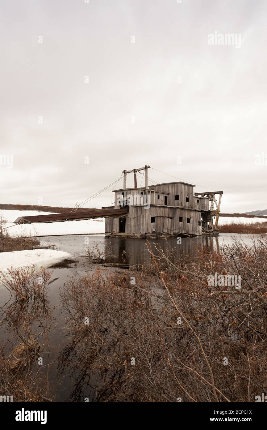 OLD GOLD MINING DREDGE IN RIVER ON THE ALASKAN TUNDRA Stock Photo - Alamy