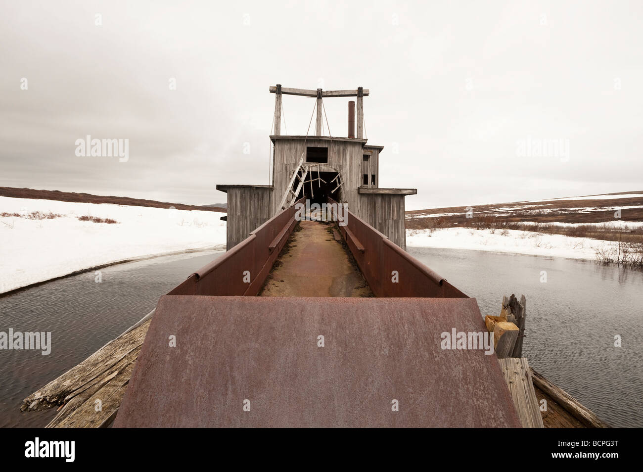OLD GOLD MINING DREDGE IN RIVER ON THE ALASKAN TUNDRA Stock Photo - Alamy