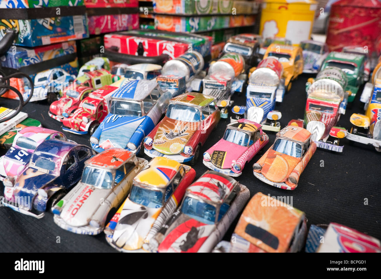 Toy cars made from aluminium drinks cans on sale at a market stall ...