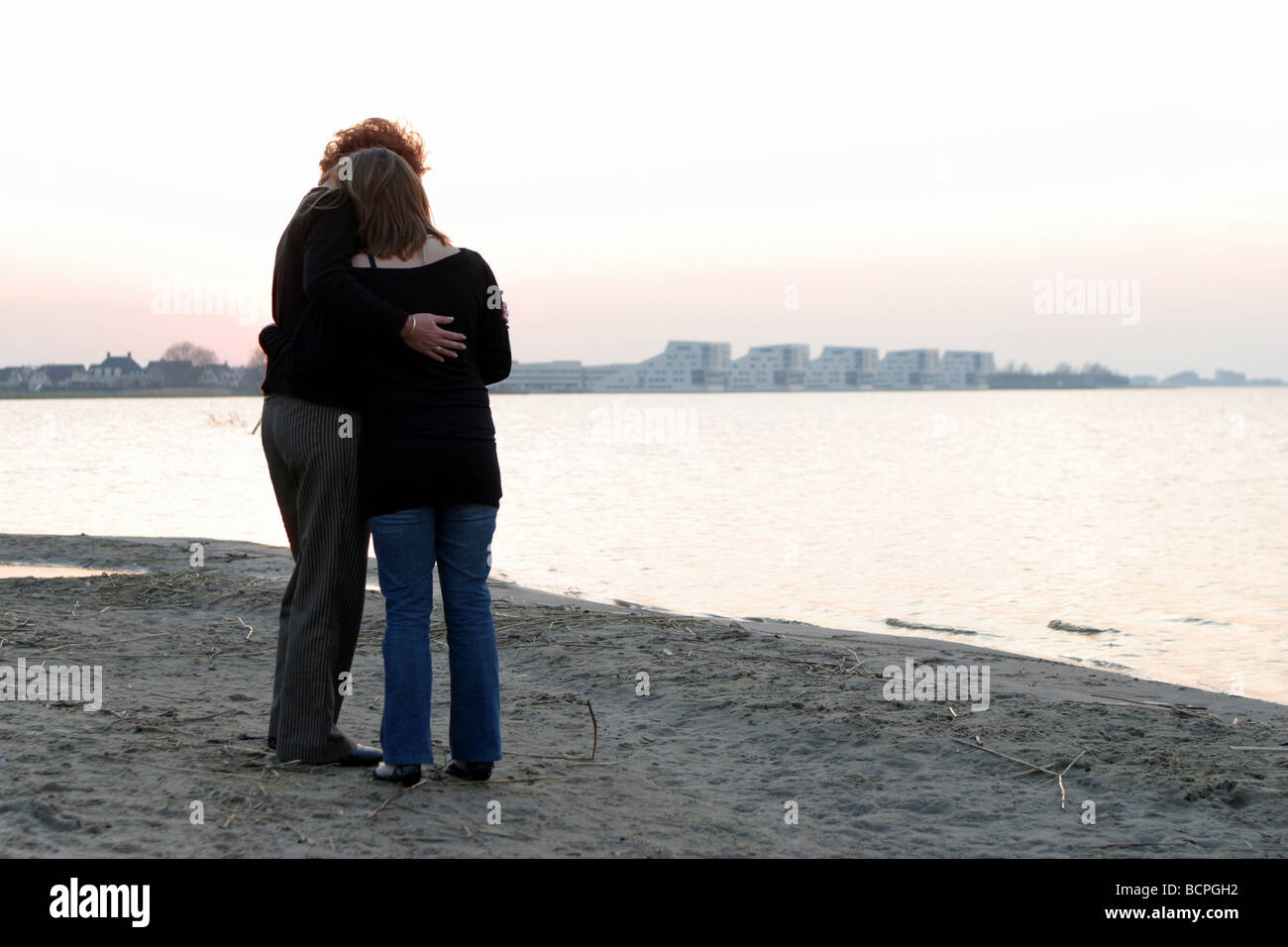Mother comforting teenage daughter at beach anonymous Stock Photo - Alamy
