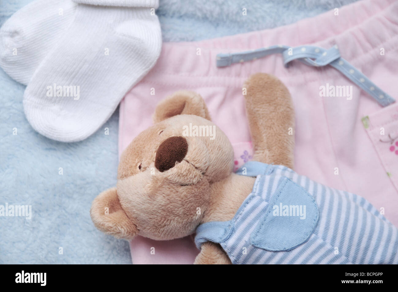 Baby clothes teddy bear hi-res stock photography and images - Alamy