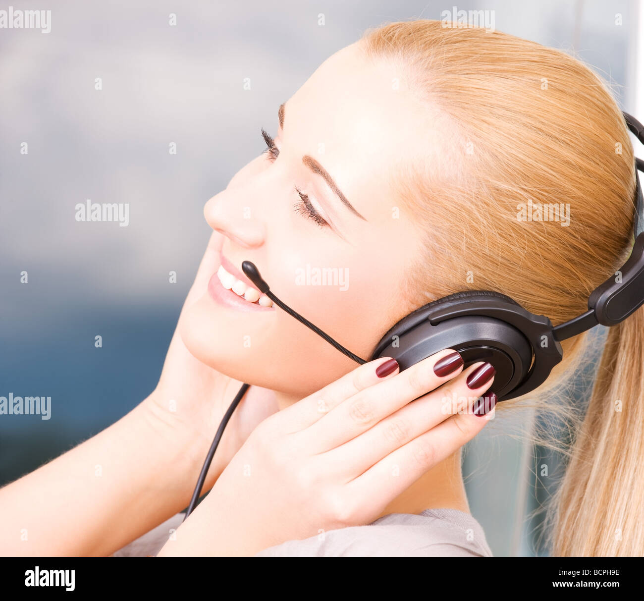 bright picture of friendly female helpline operator Stock Photo - Alamy
