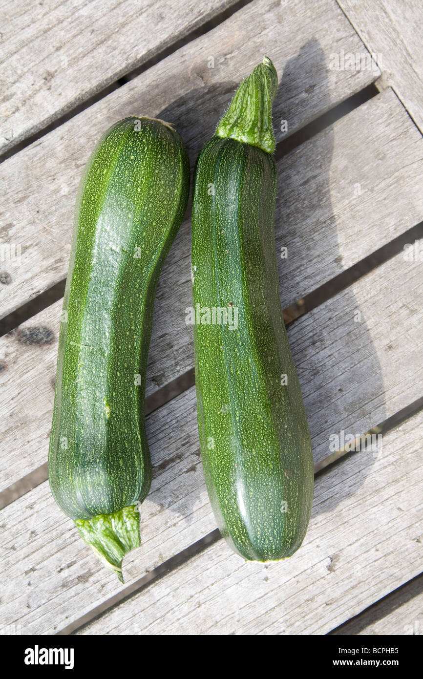 Two courgettes on table looking down Stock Photo - Alamy