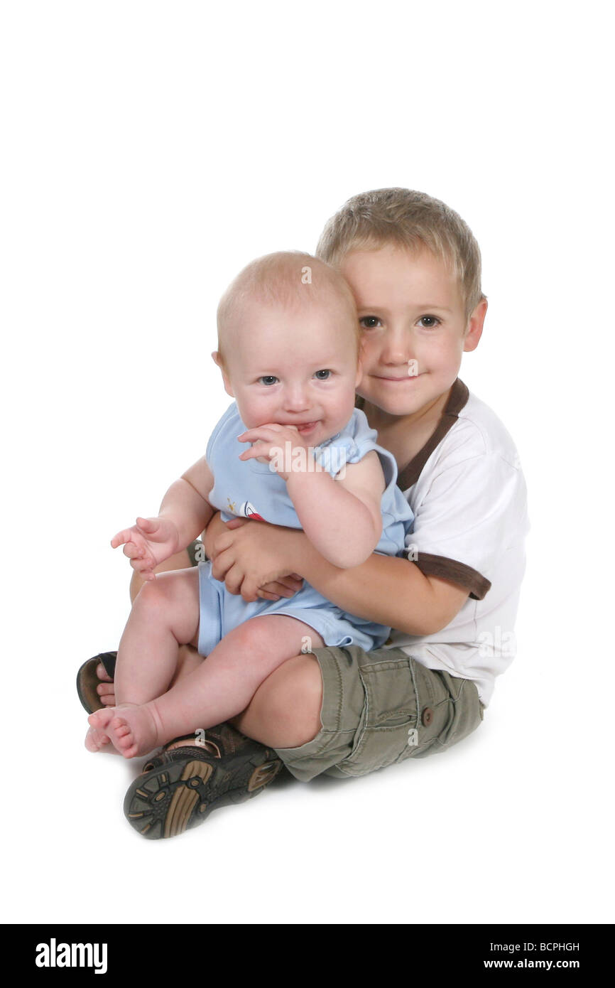 Two Brothers Sitting Together on a White Background Stock Photo - Alamy