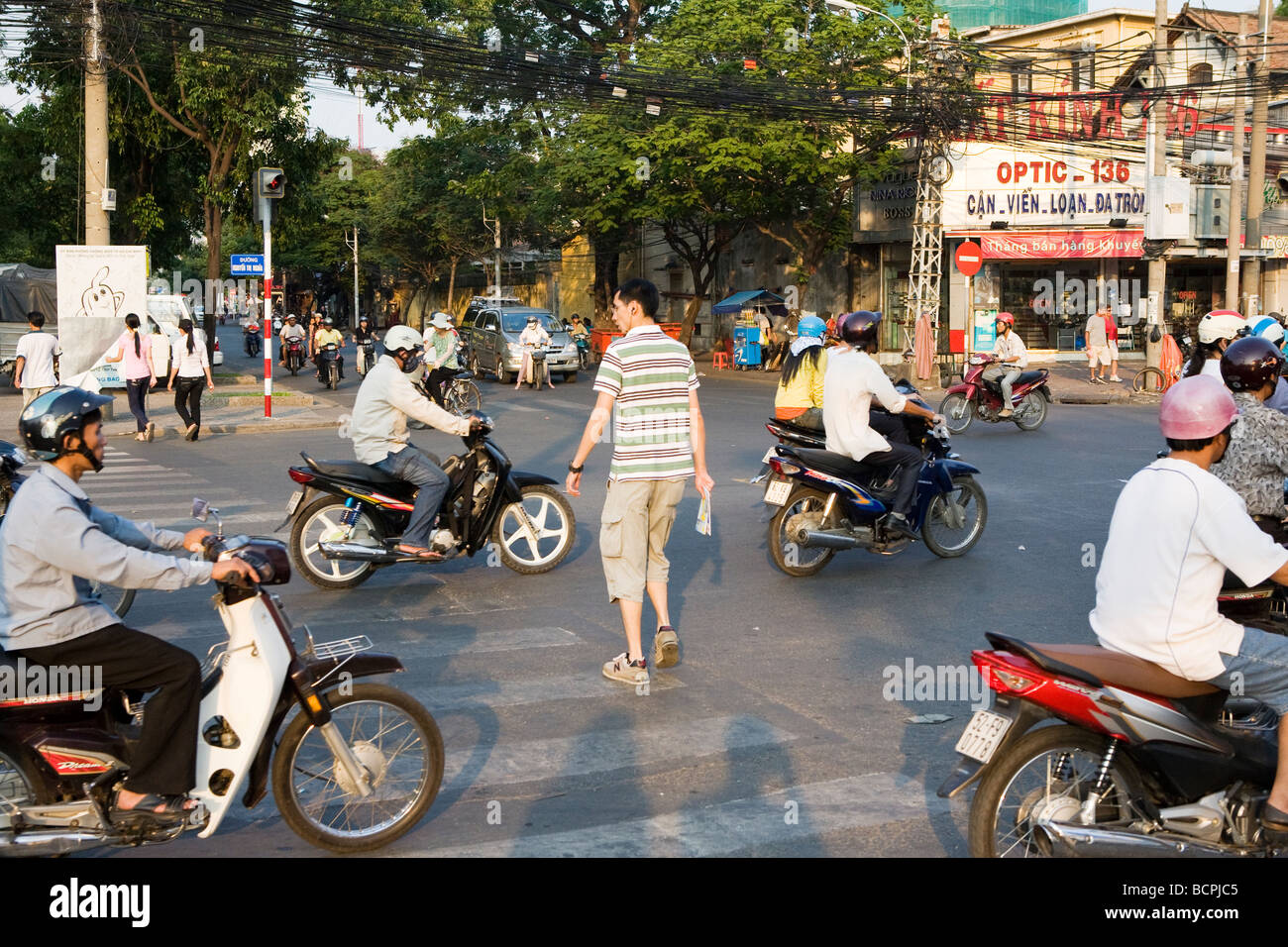 People riding scooters/mopeds in Vietnam in Ho Chi Minh City Stock ...