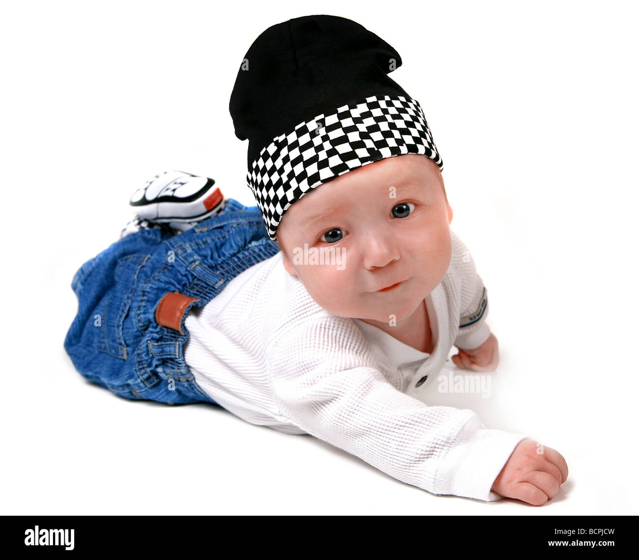 Baby Boy on His Tummy Looking Up Wearing a Bini Hat Stock Photo - Alamy