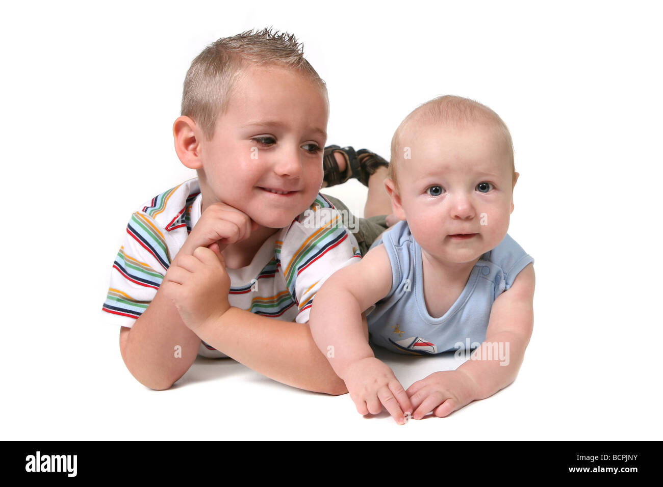 Brothers Interacting Together on a White Background Stock Photo - Alamy