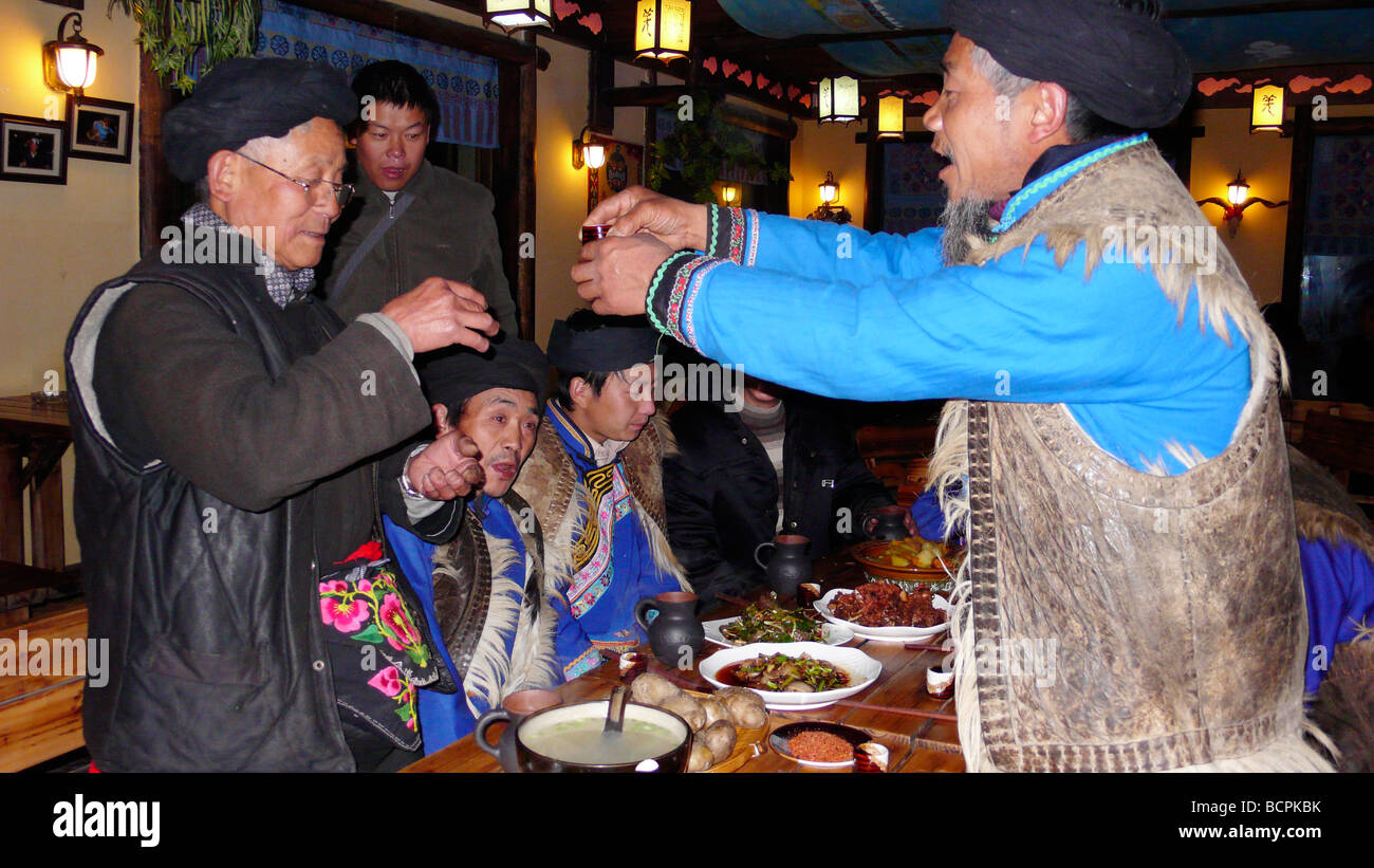 Qiang minority priests cheering after completion of a religious ritual ...