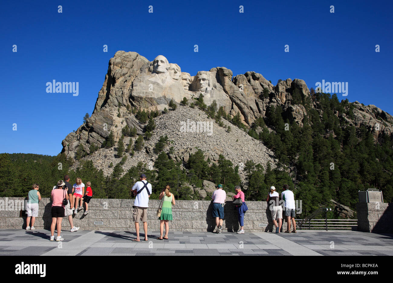 Summer tourists on the Grand View Terrace at Mount Rushmore National ...