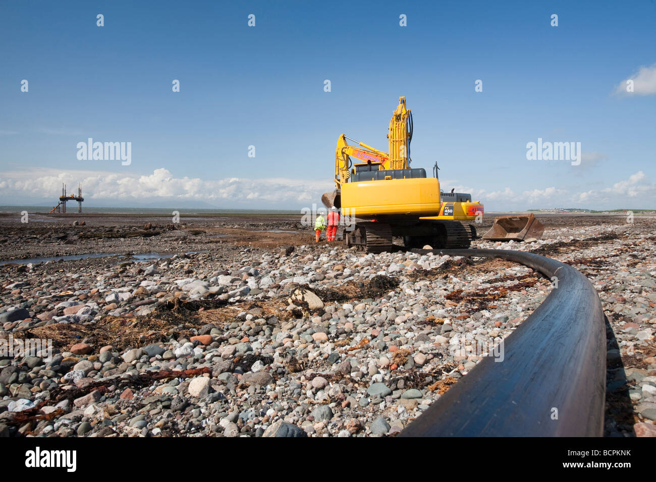 Construction work bringing the electric supply ashore from Robin Rigg ...