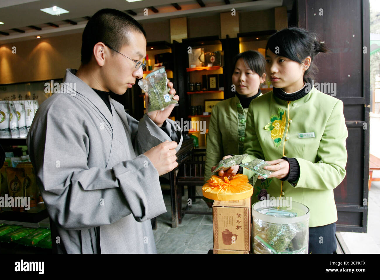 Monk from Wenshu Temple buying tea from a tea shop, Chengdu, Sichuang ...