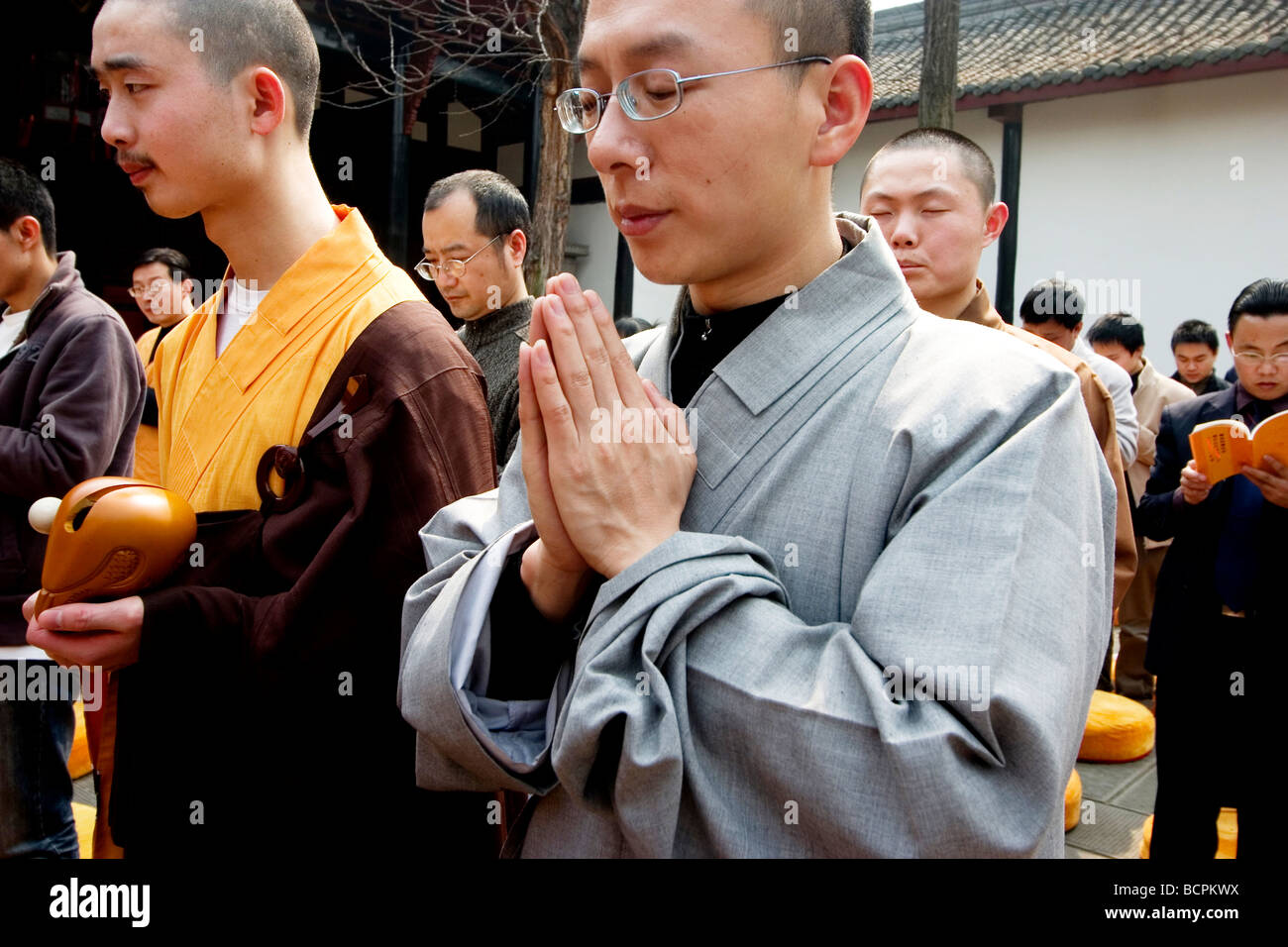 Monks and Jushi praying, Wenshu Temple, Chengdu, Sichuang Province ...