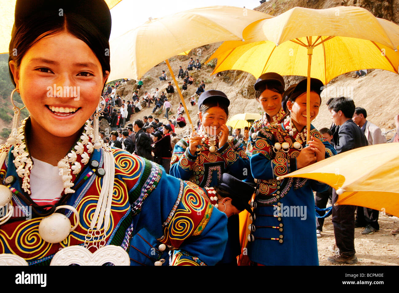 Yi Minority young women wearing elaborate festive costume during Torch Festival, Liangshan Yi ...