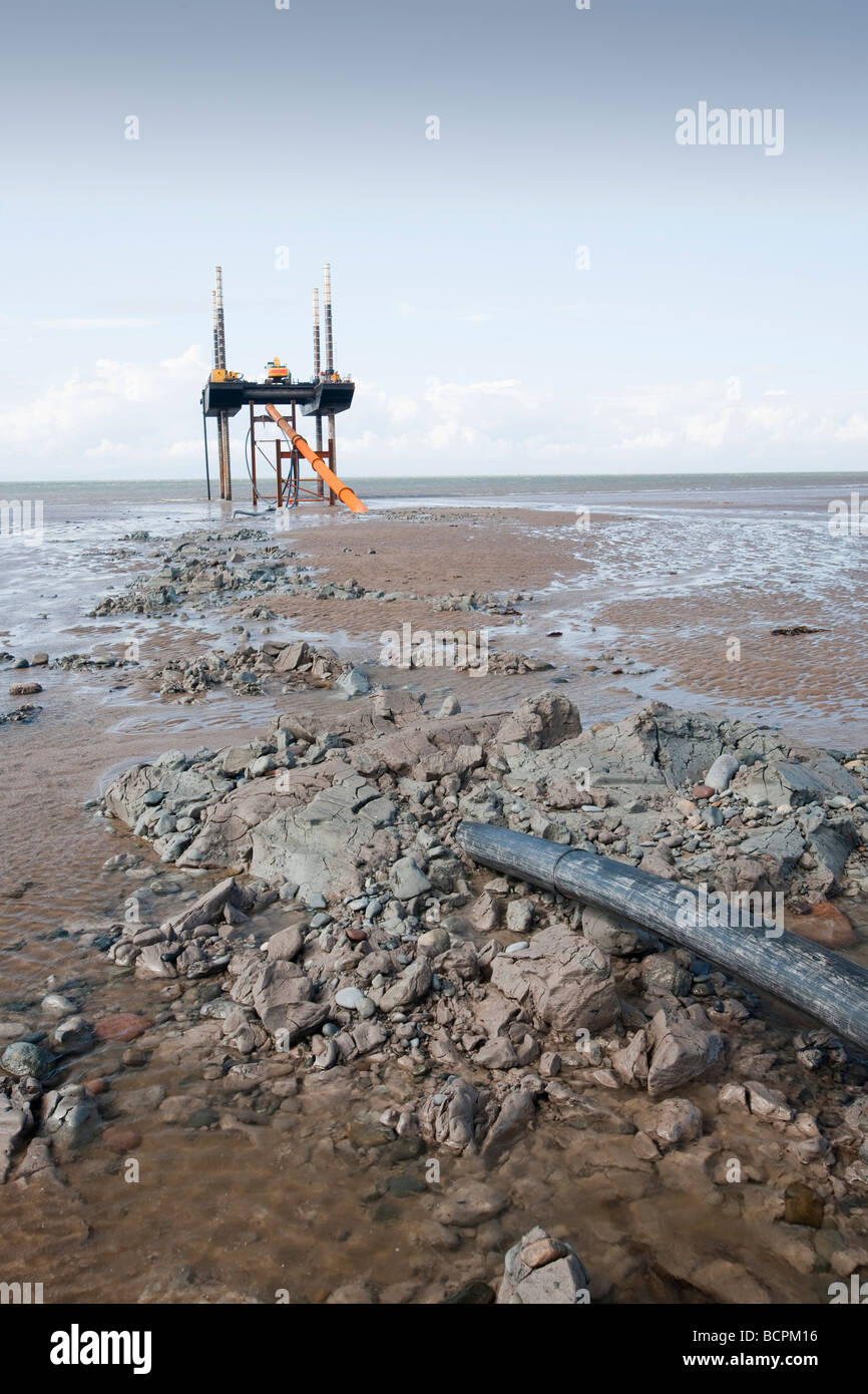 Construction work bringing the electric supply ashore from Robin Rigg ...