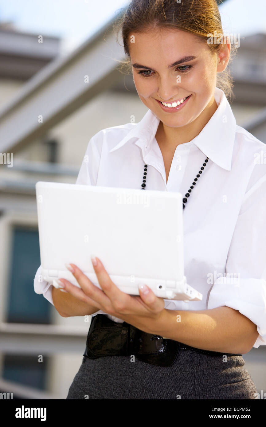 picture of happy businesswoman with laptop computer Stock Photo - Alamy