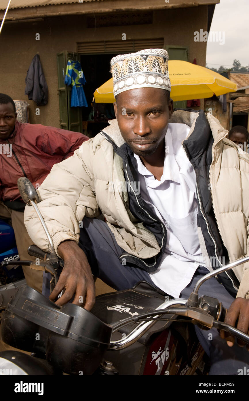 Boda boda rider on street in Kamwockya Kampala Uganda Stock Photo - Alamy