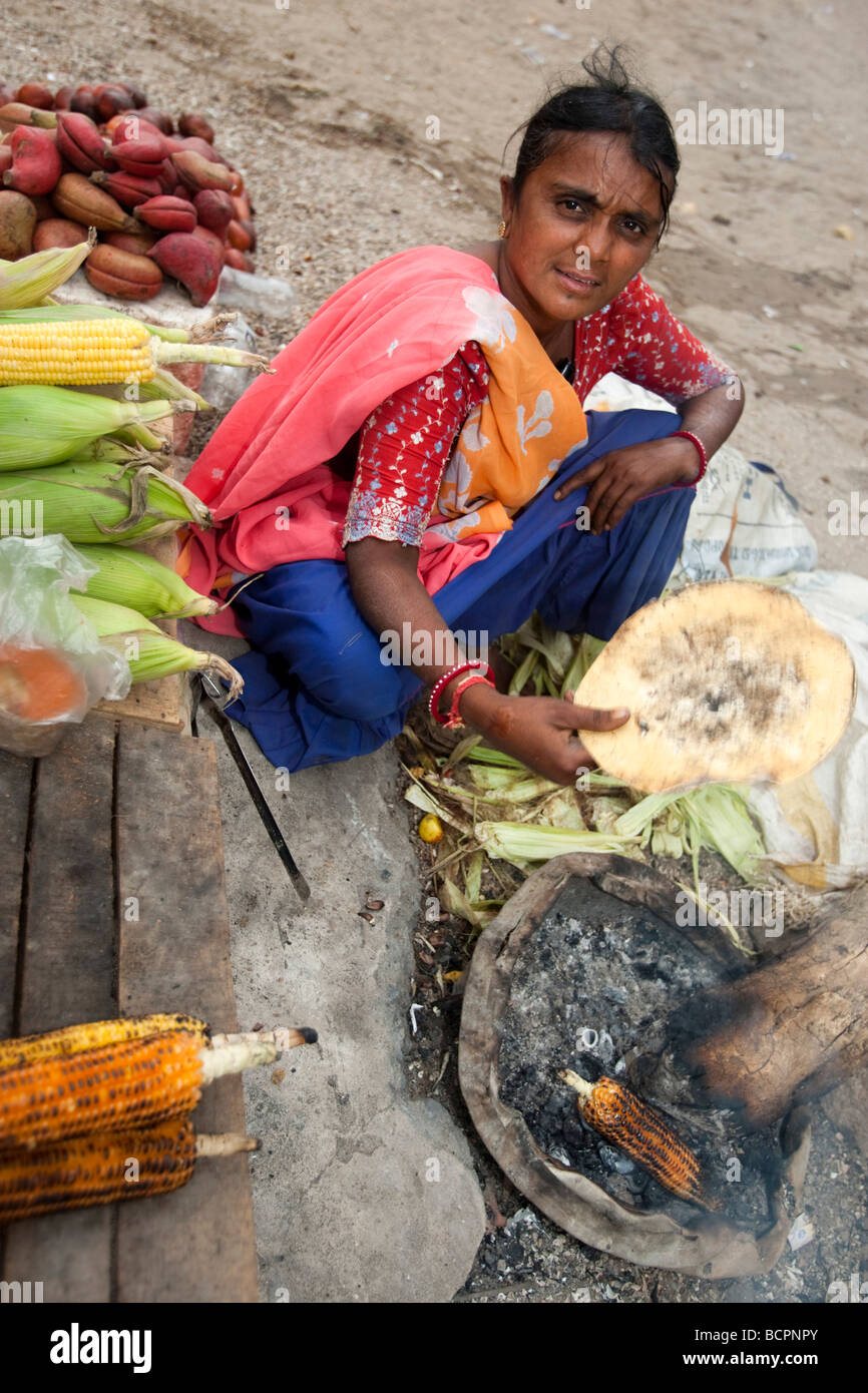 Indian woman roasting corn for snacks Nagoa Beach Diu India Stock Photo ...