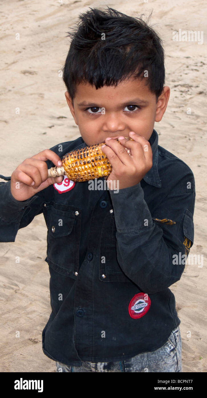 Child eating cob roasted corn food hi-res stock photography and images ...