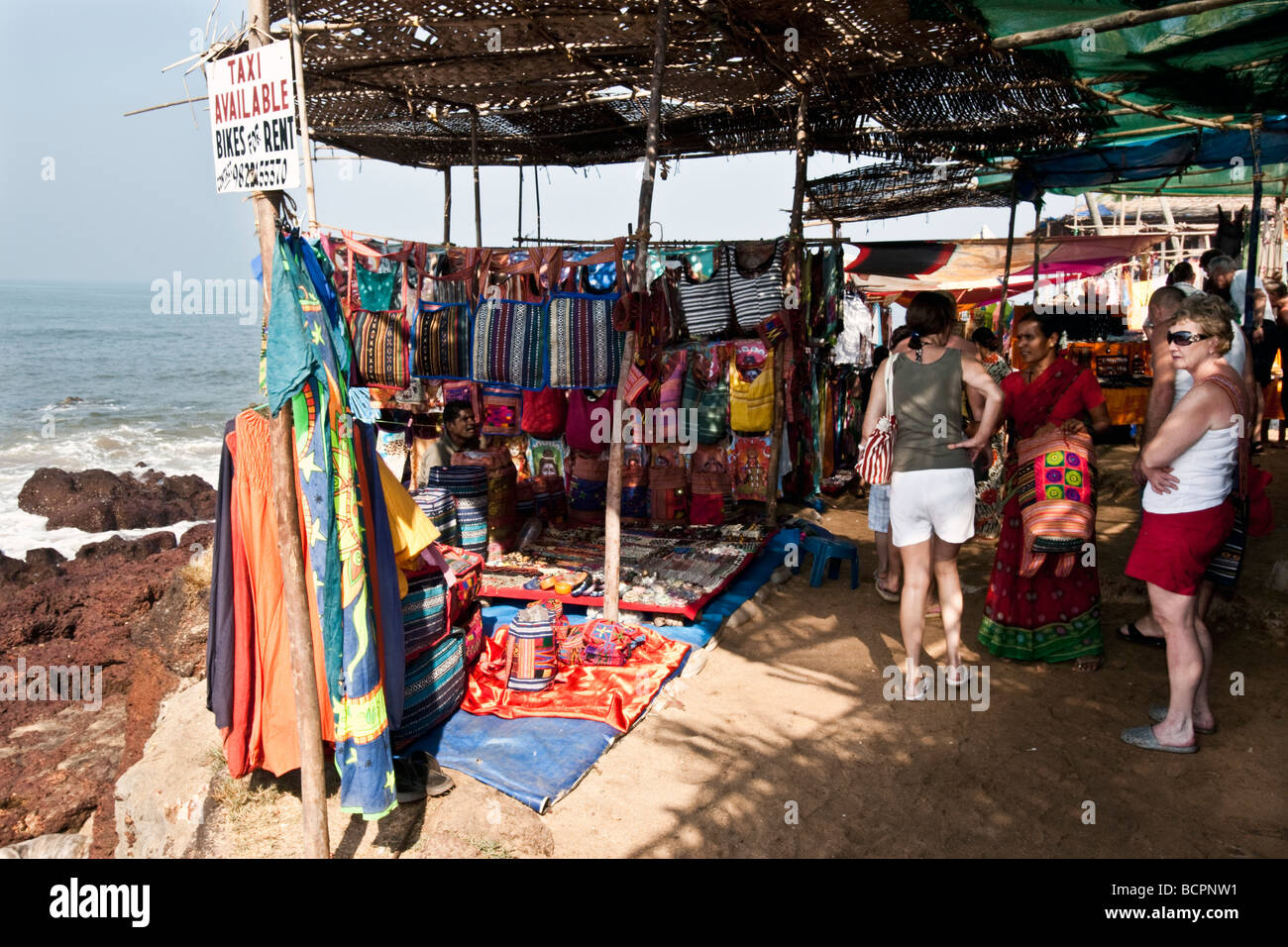 Anjuna weekly hippy flea market Goa India Stock Photo - Alamy