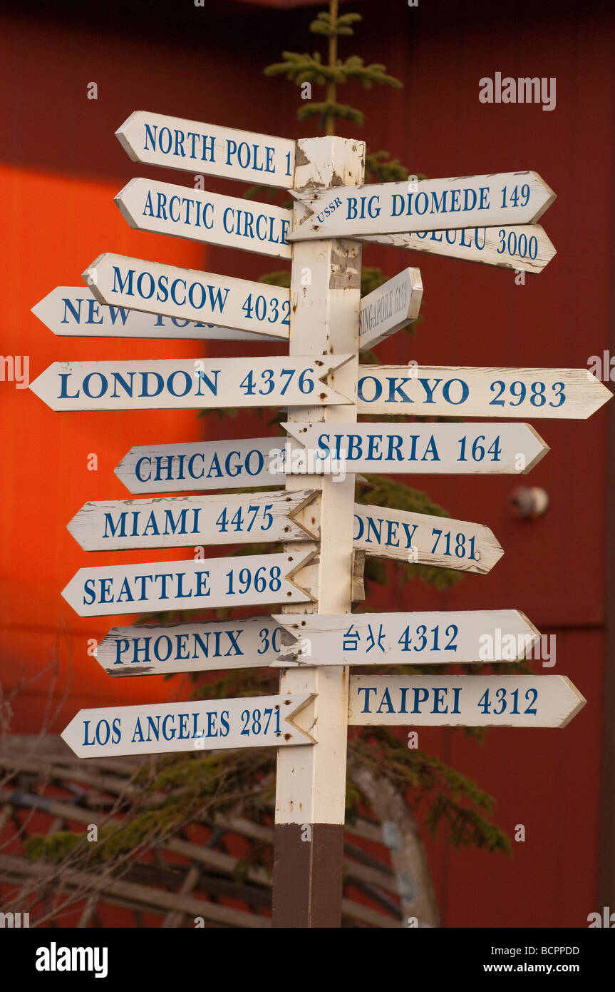 A SIGN INDICATES THE DISTANCES TO NEAREST CITIES NOME ALASKA Stock ...