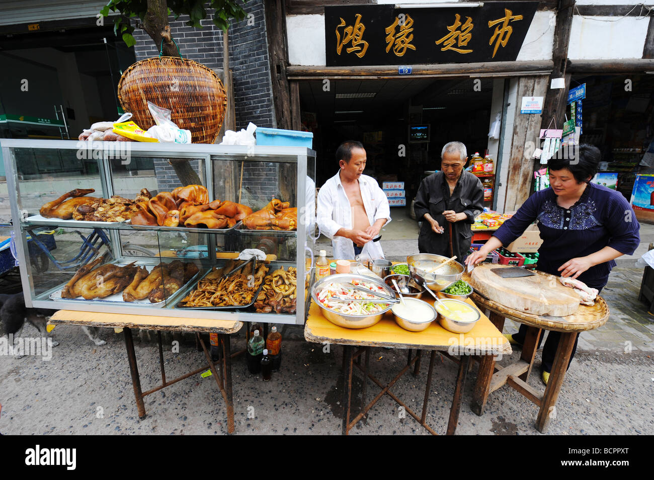 Street food cart selling various local delicacy, Lizhuang Ancient Town ...