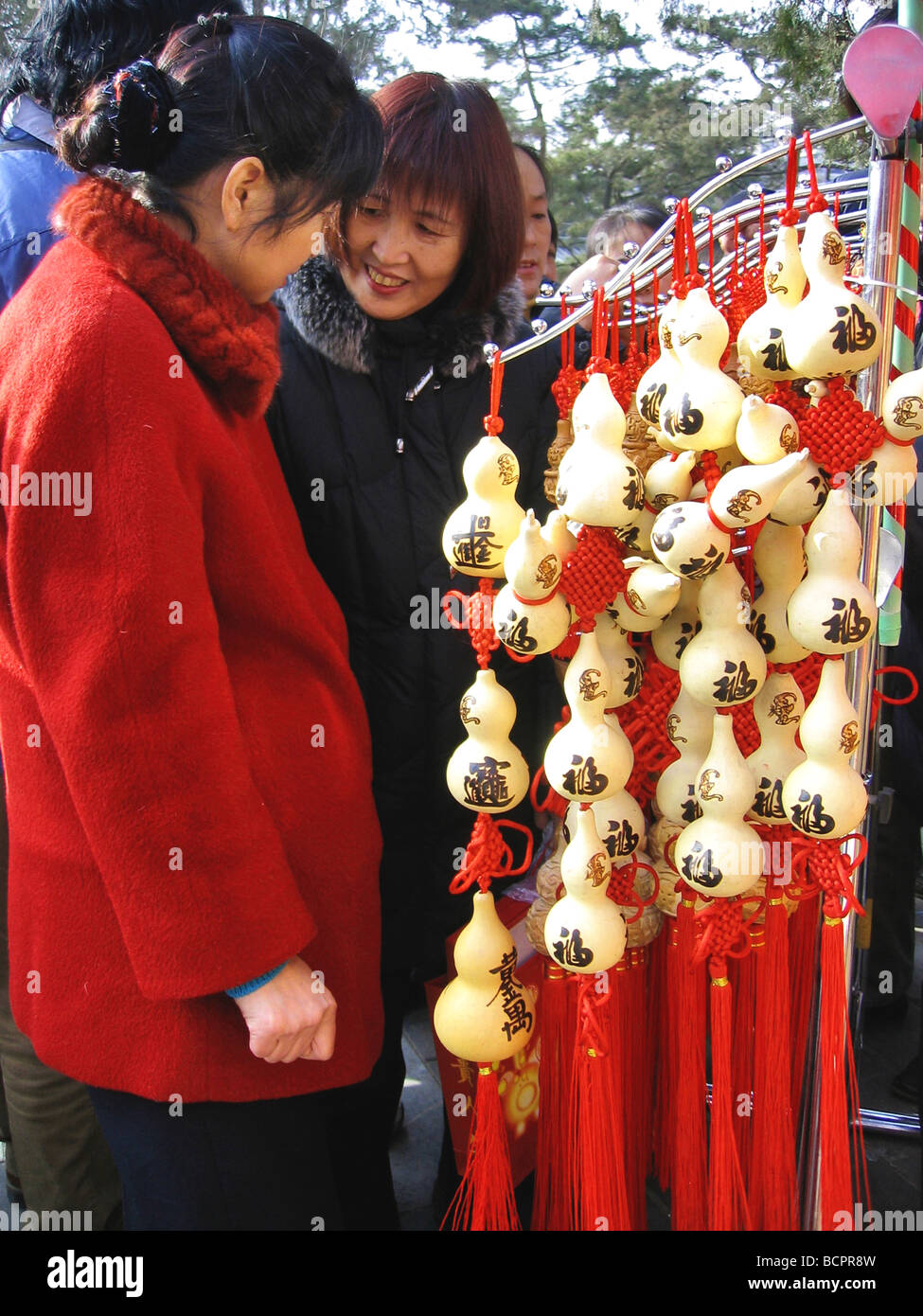 Fair goers selecting decorative gourd symbolize luck and prosperity ...