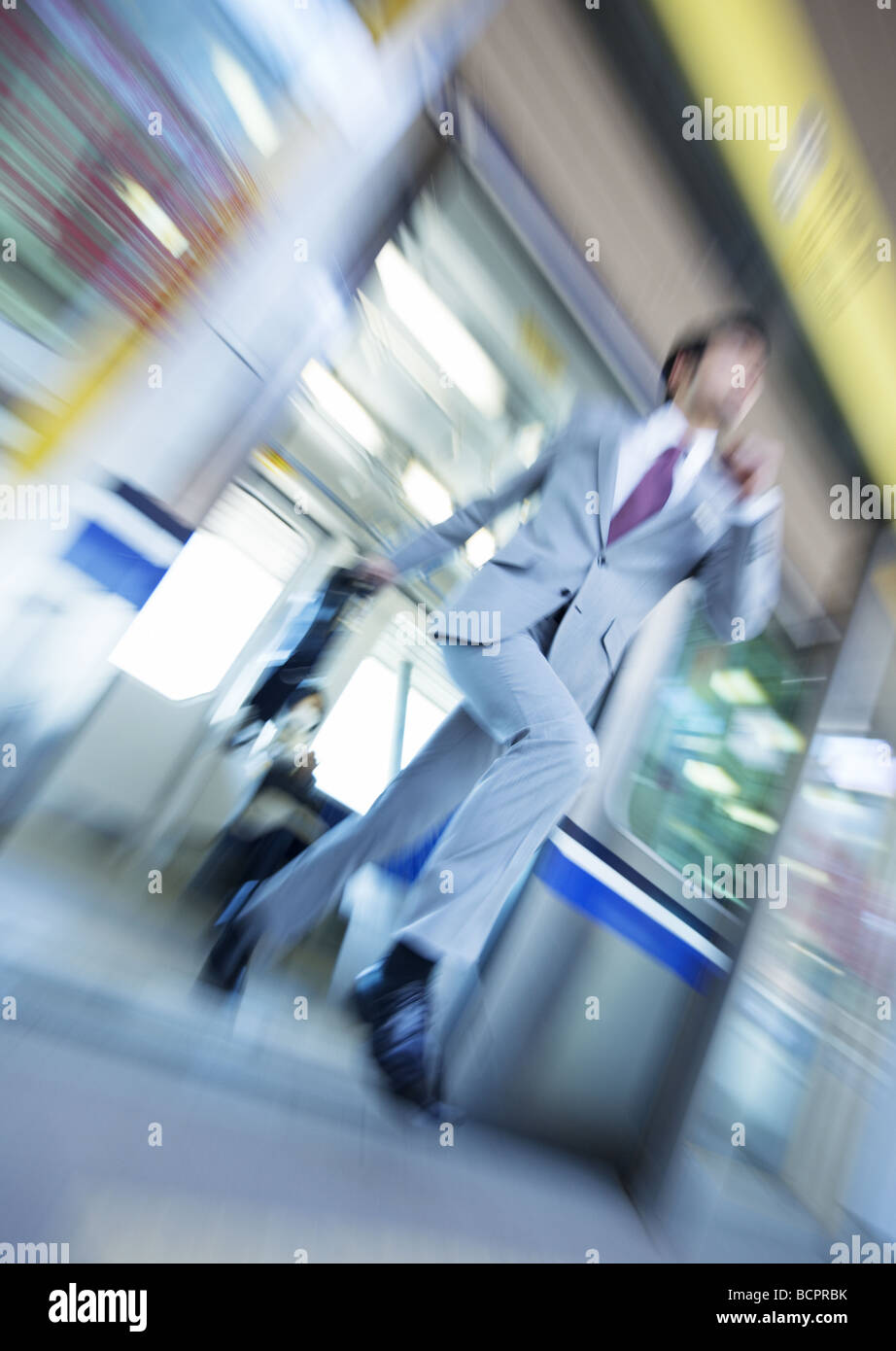 Businessman getting off train hi-res stock photography and images - Alamy