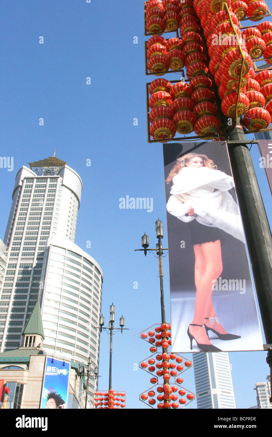 Office building and large outdoor advertisement featuring foreign woman ...