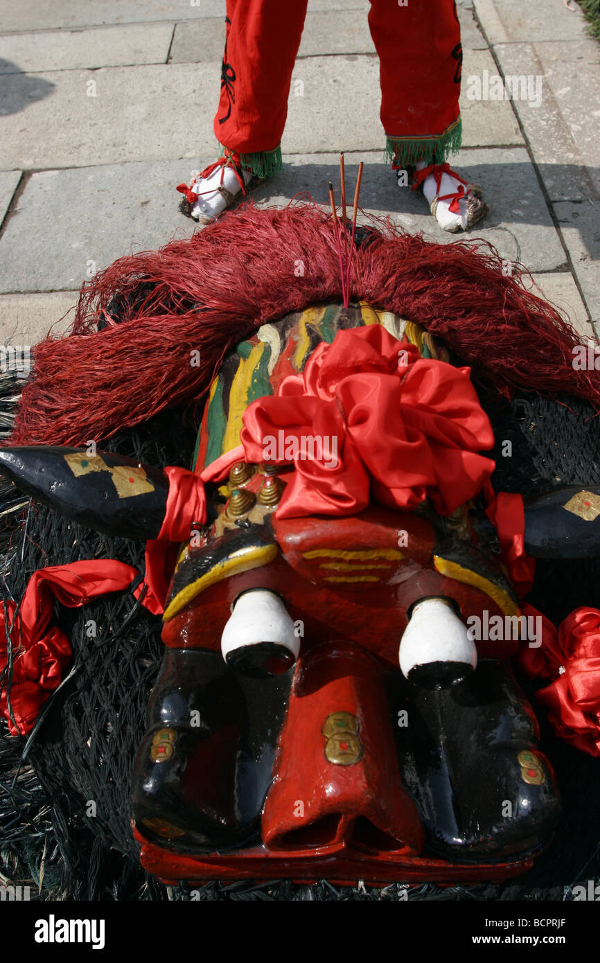Giant dragon head in bold color as stage prop for local opera ...