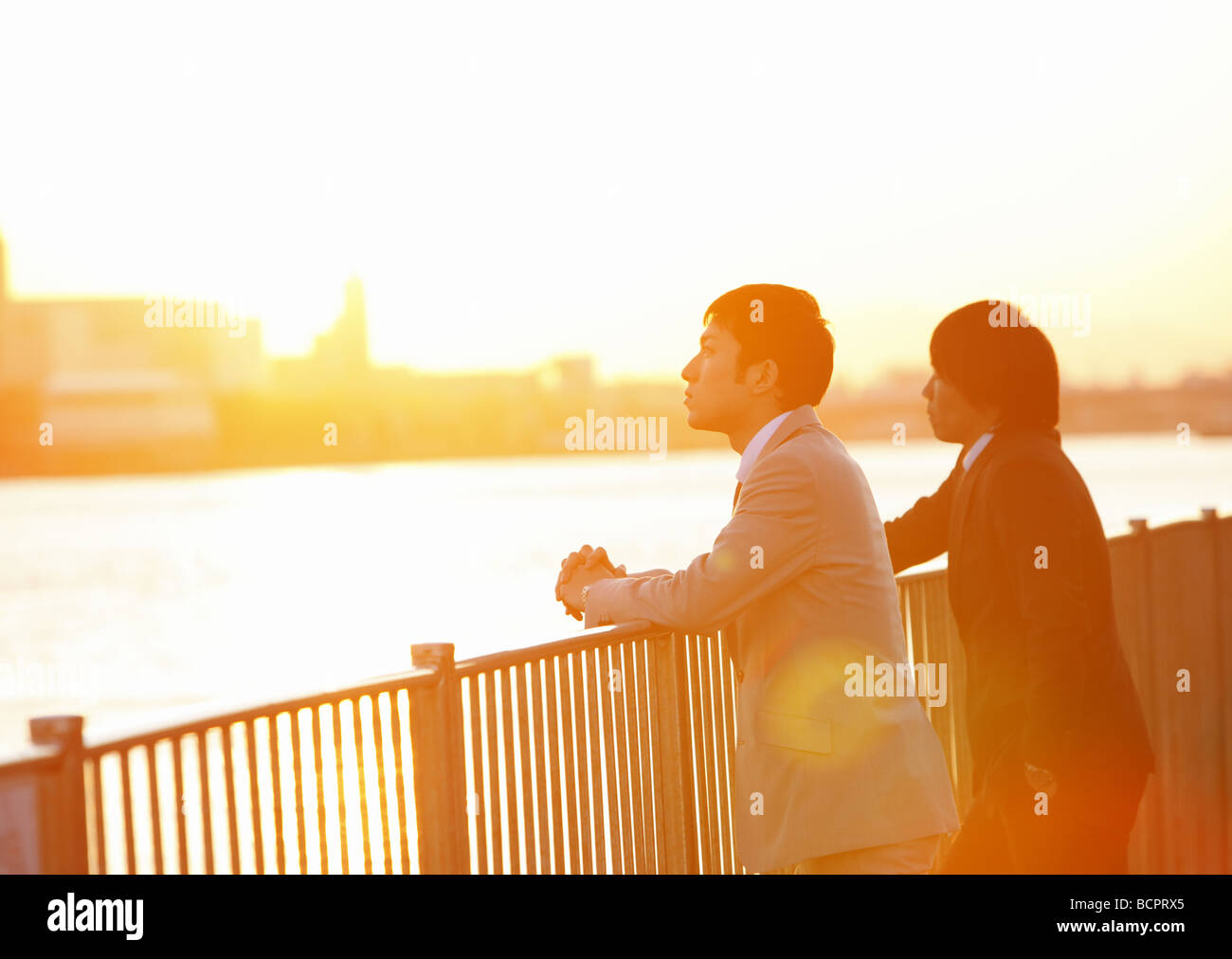 Businessmen looking into the far distance Stock Photo - Alamy