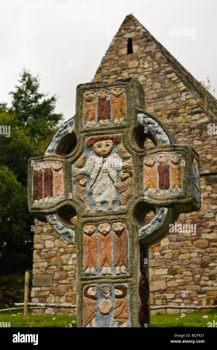 Ornate painted celtic cross with a depictino of Saint Patrick in the ...